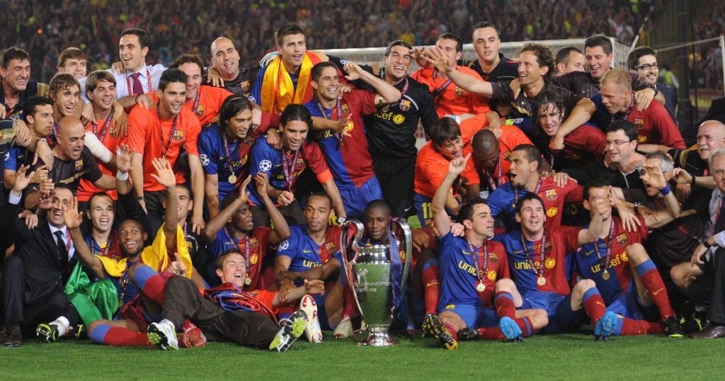 Barcelona players celebrate with the trophy after the UEFA Champions ...